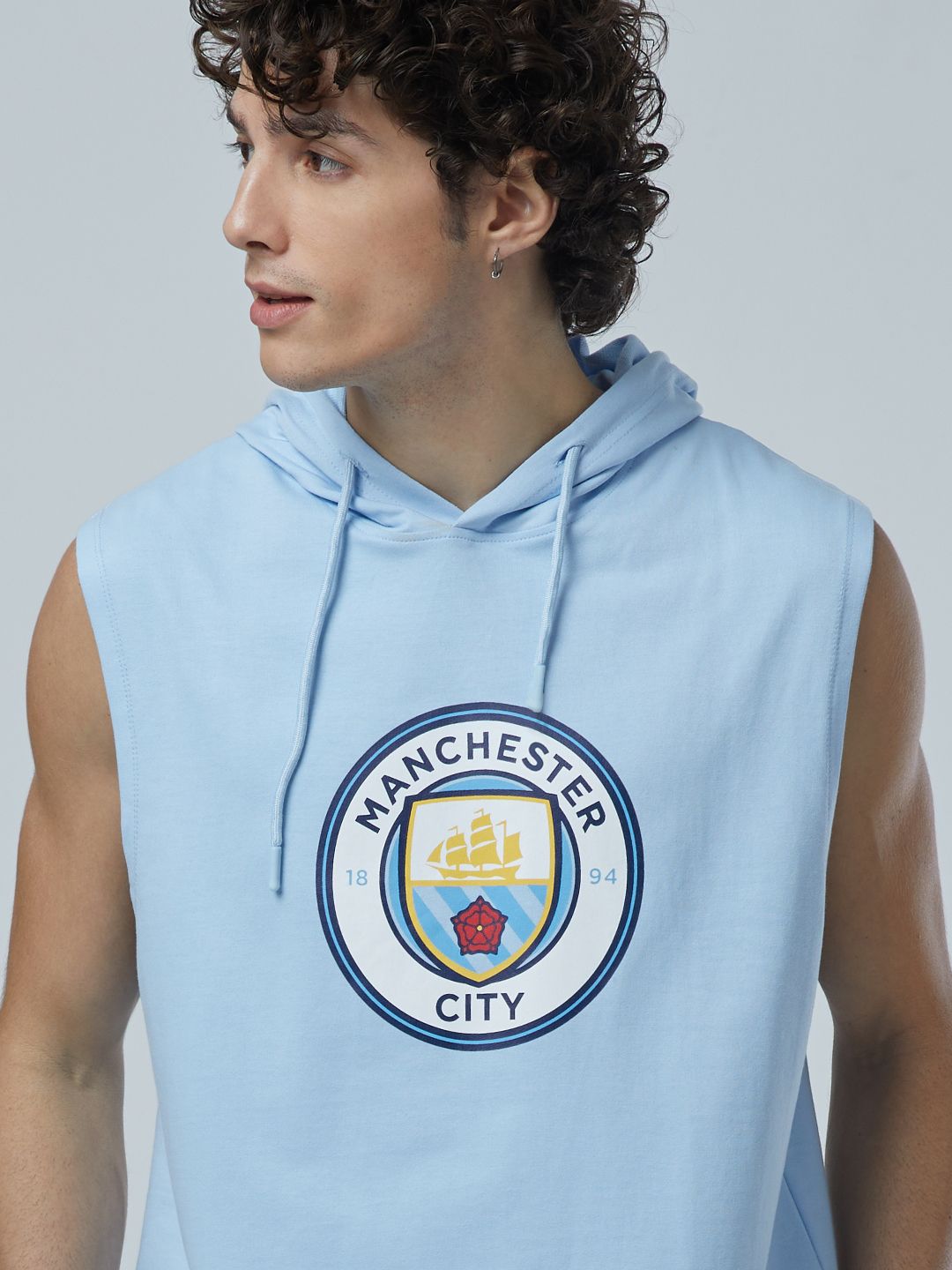 Buy Manchester City: Crest Hooded Vest For Men Online.